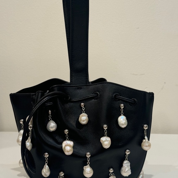 Alaia | Bags | Alaia Rose Marie Pearl Detail Calfskin Wristlet Noir Bag ...